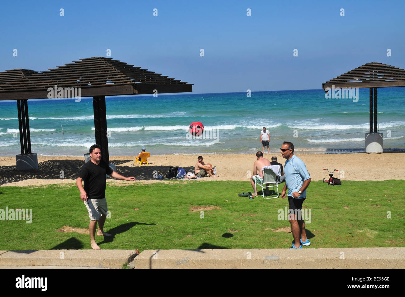Israel, Haifa, Carmel Beach, Israelis go to the Beach on a warm, sunny ...