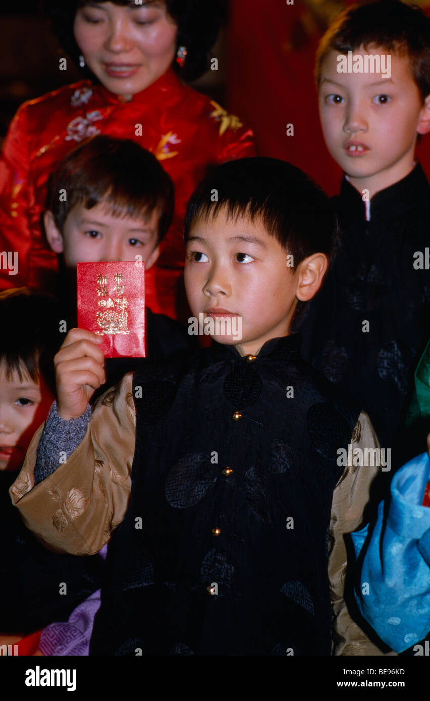 ENGLAND London Soho Chinatown Chinese New Year Children Boy holding up ...