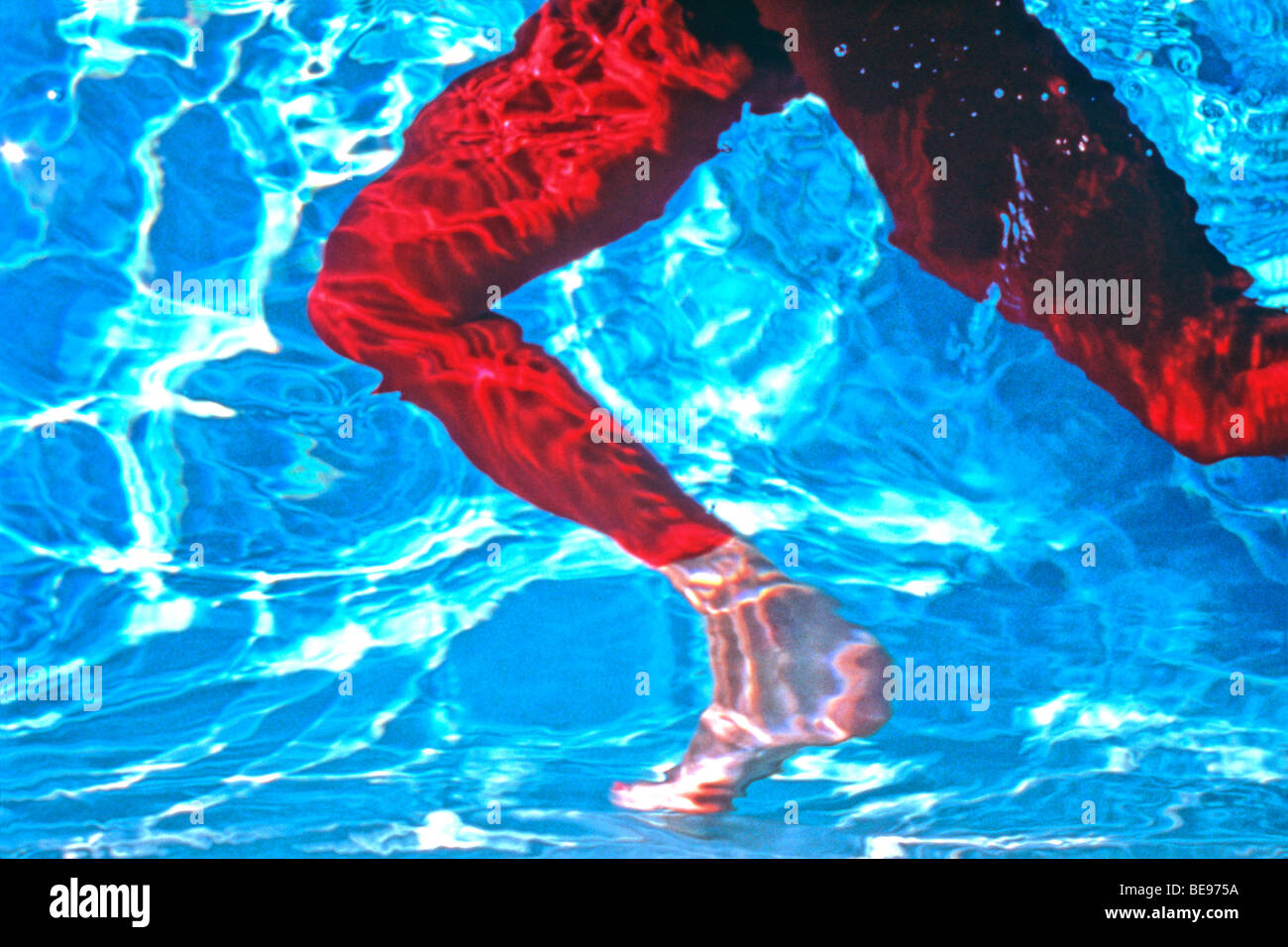 woman in red leggings running underwater Stock Photo - Alamy