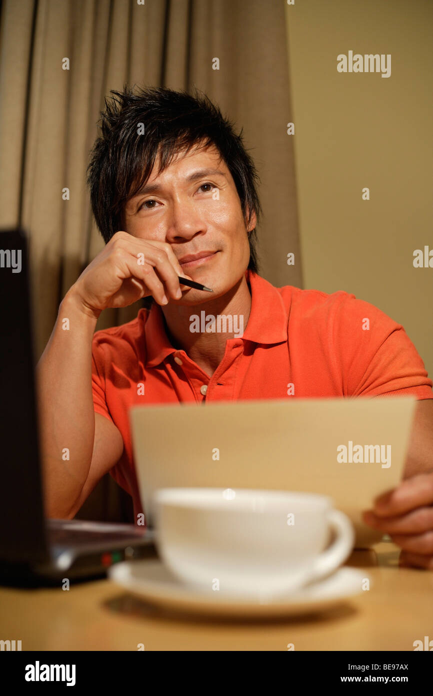 Man working table hi-res stock photography and images - Alamy