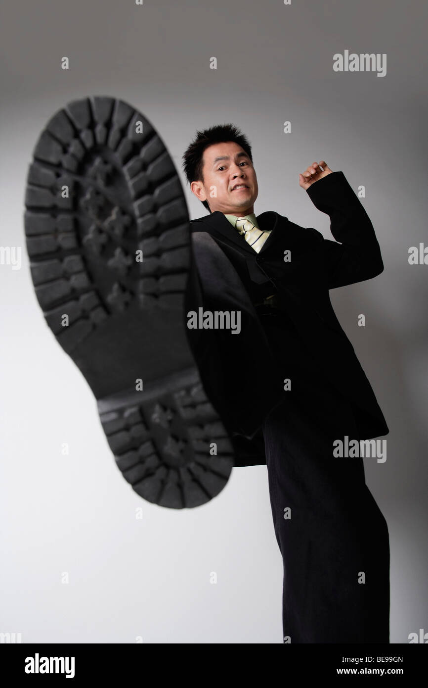 business man ready to stomp Stock Photo - Alamy