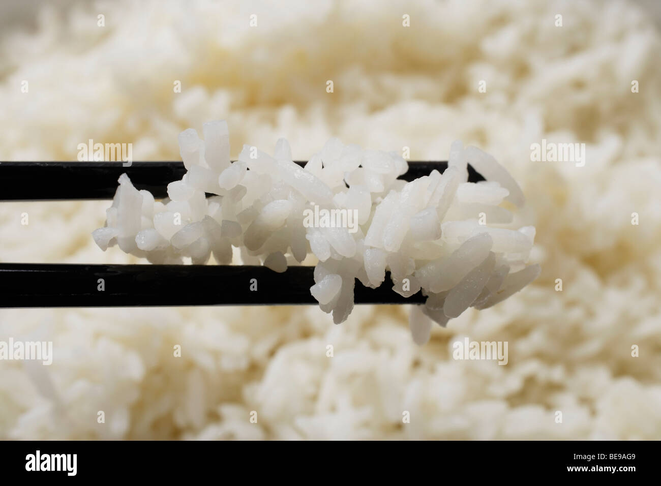 close up chopstick holding rice Stock Photo - Alamy