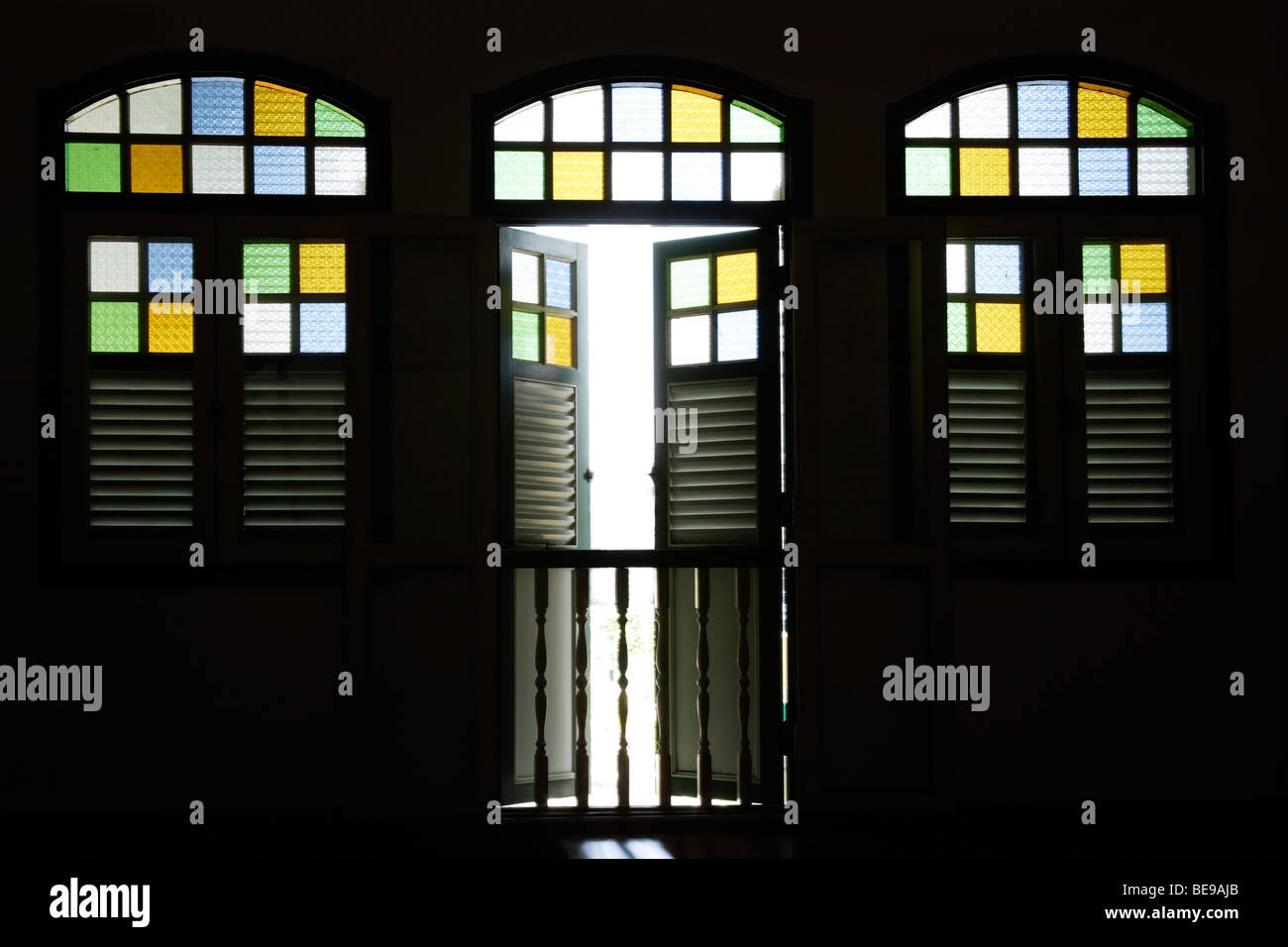 Light coming through old shop house stained glass windows Stock Photo ...