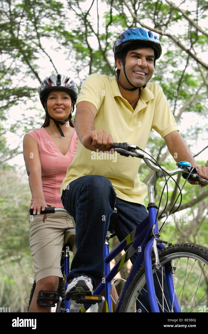 A couple ride a bike together Stock Photo - Alamy