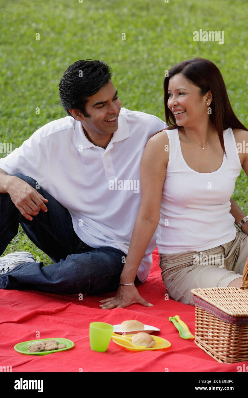 A couple have a picnic together in the park Stock Photo - Alamy
