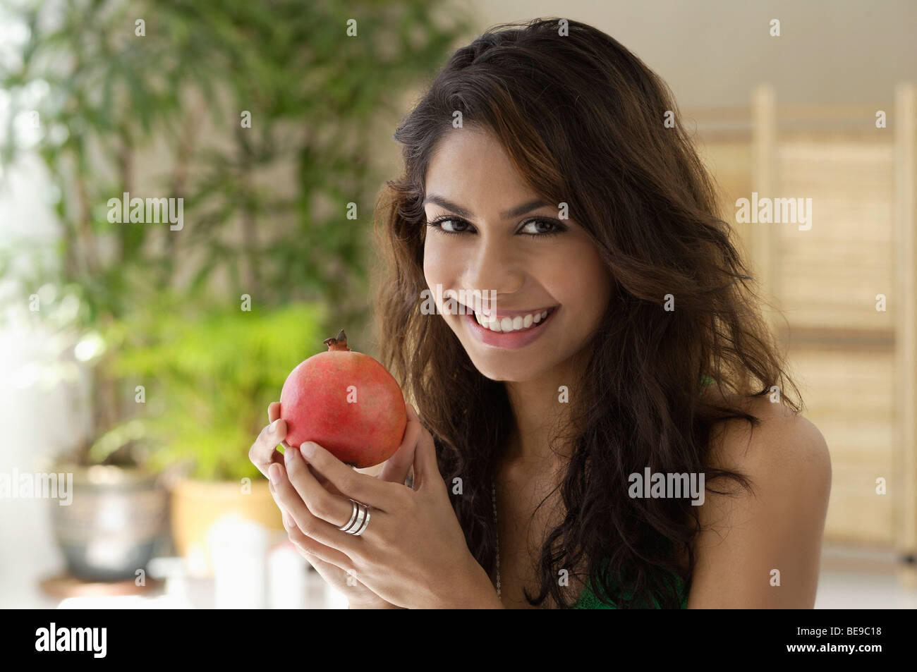 A woman eating fruit Stock Photo - Alamy