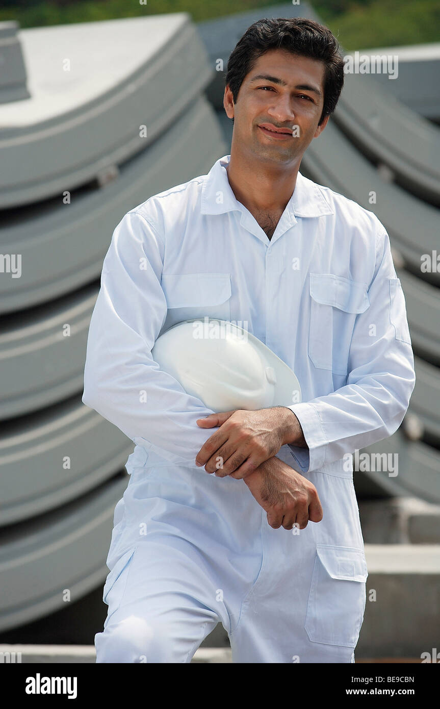 Man in work uniform, smiling at camera Stock Photo - Alamy