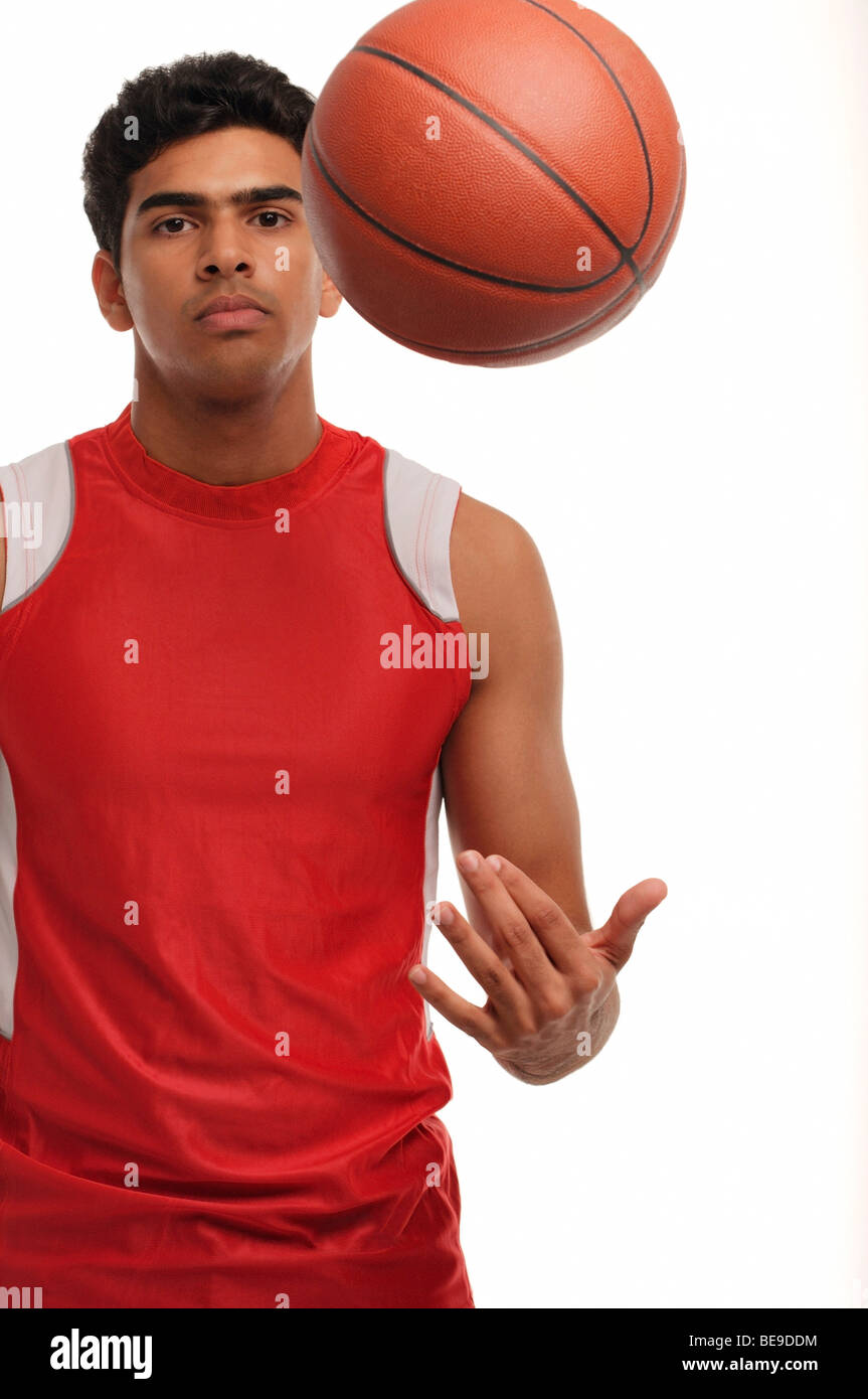 Young man with basketball looking at camera Stock Photo - Alamy
