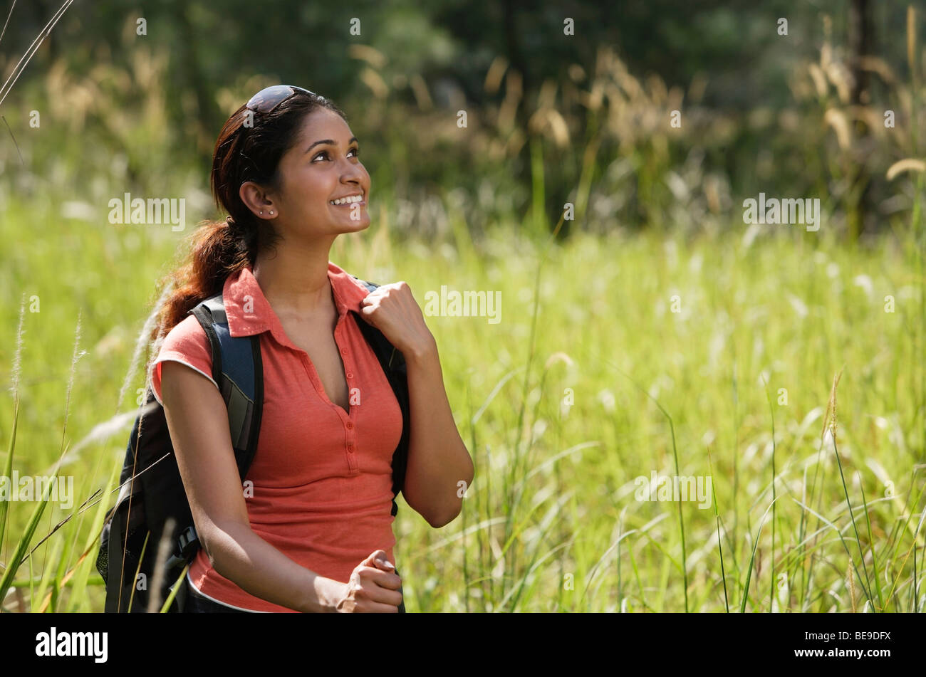 Young woman hiking in the wilderness Stock Photo - Alamy
