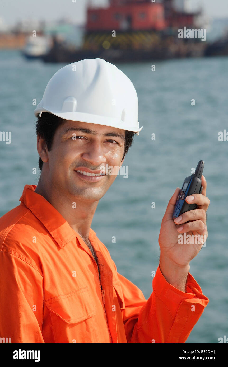Man in work uniform smiling at camera Stock Photo - Alamy