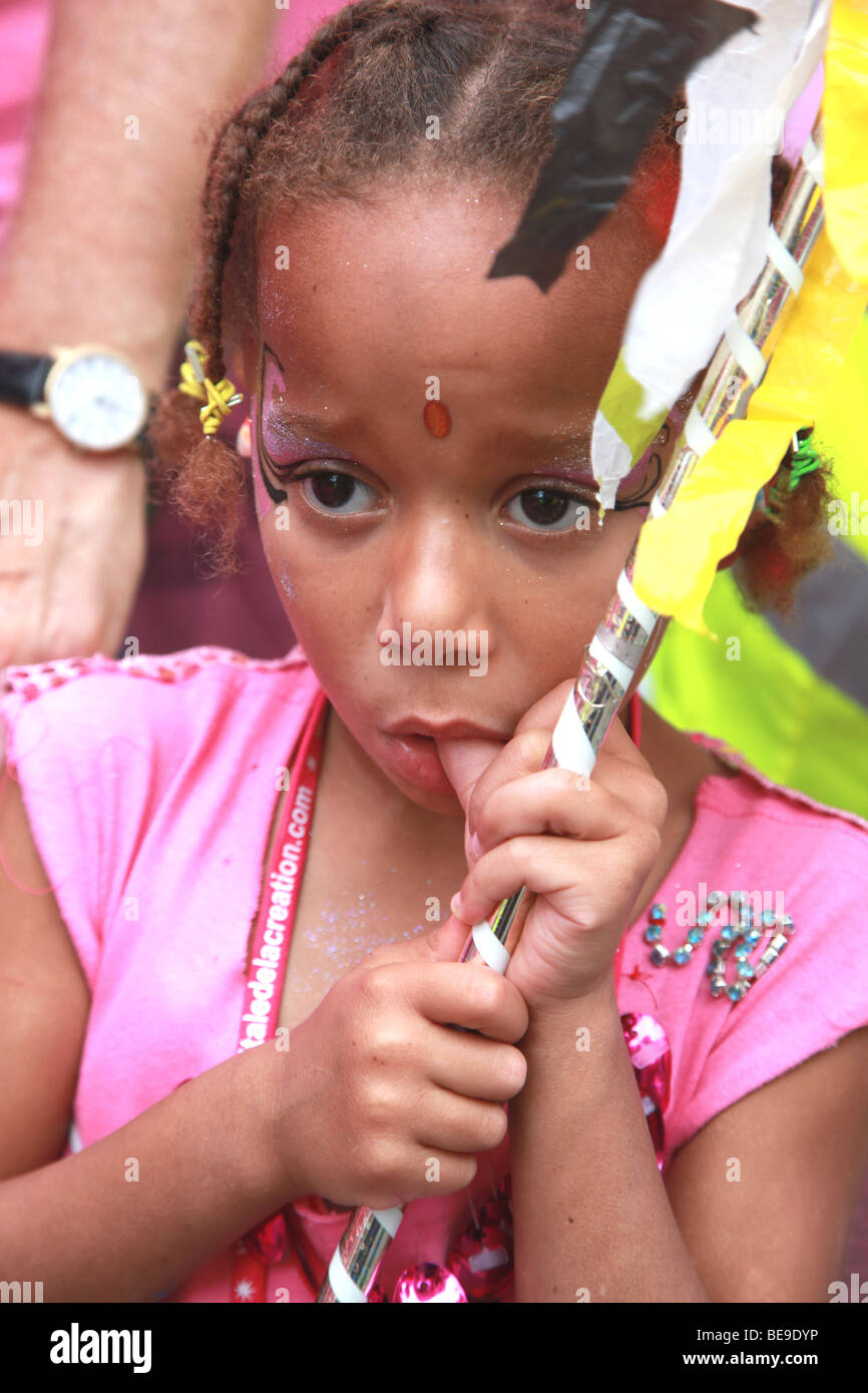 Overwhelmed girl at The Notting Hill Carnival Stock Photo - Alamy