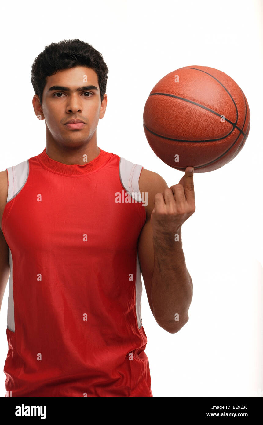 Young man with basketball looking at camera Stock Photo - Alamy