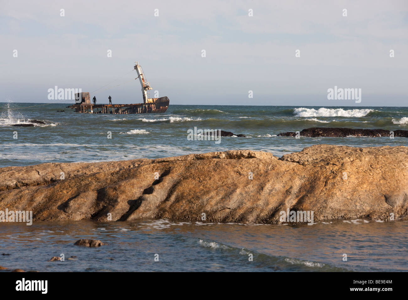 Salvage work on the wreck of a ship on the Skeleton Coast in Namibia ...
