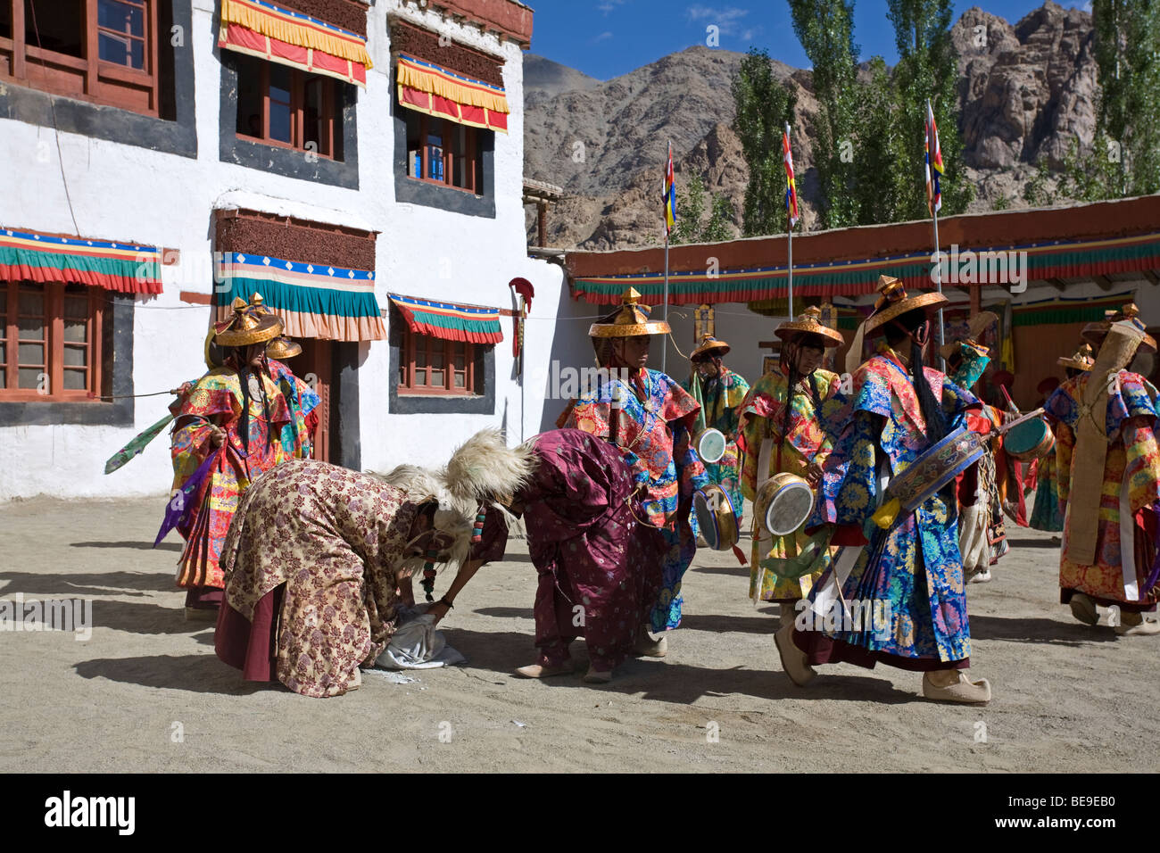 Buddhist monks dressed with traditional costumes performing a ritual ...