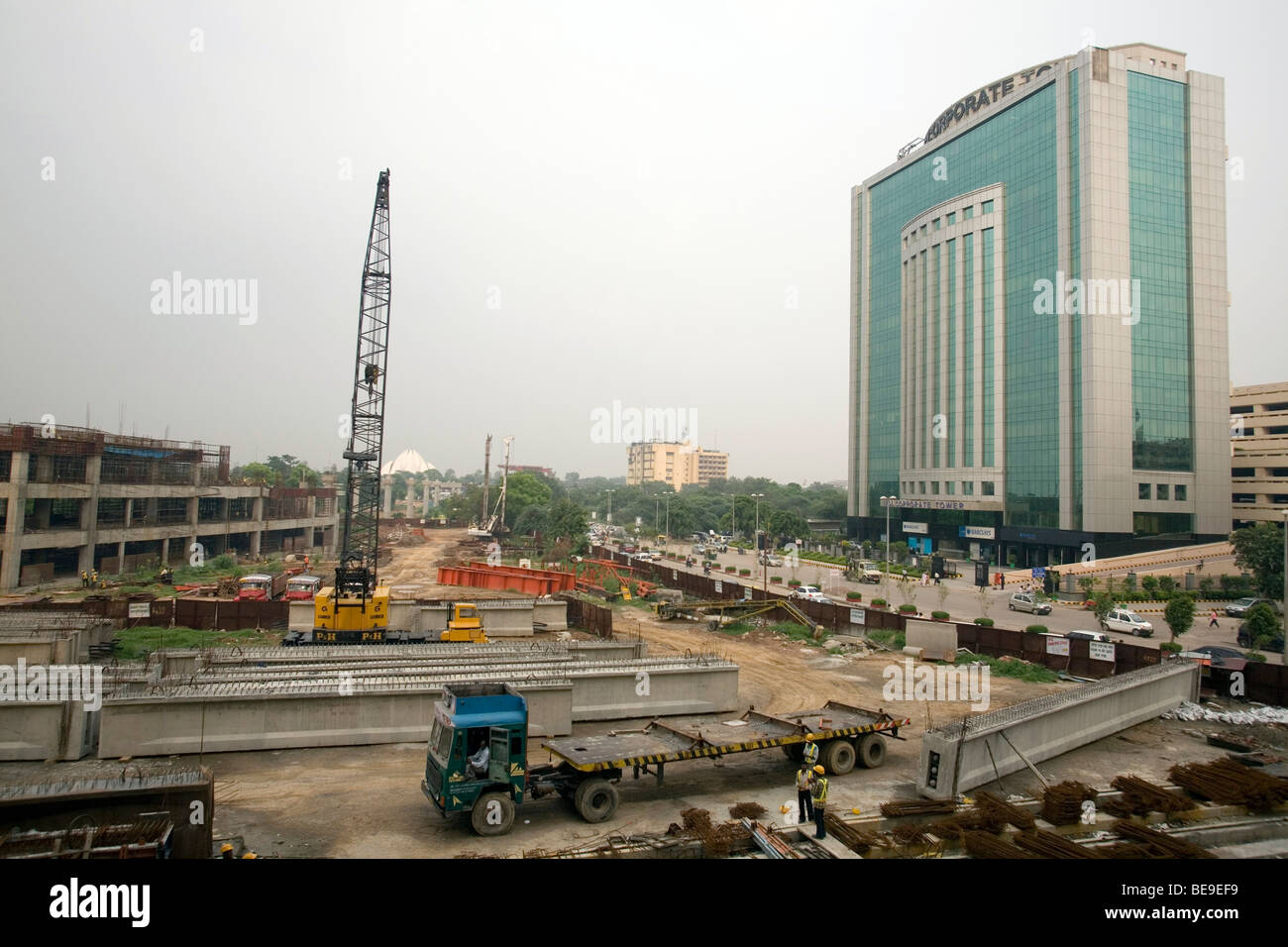 Workers on a construction site building an extension to the city's ...