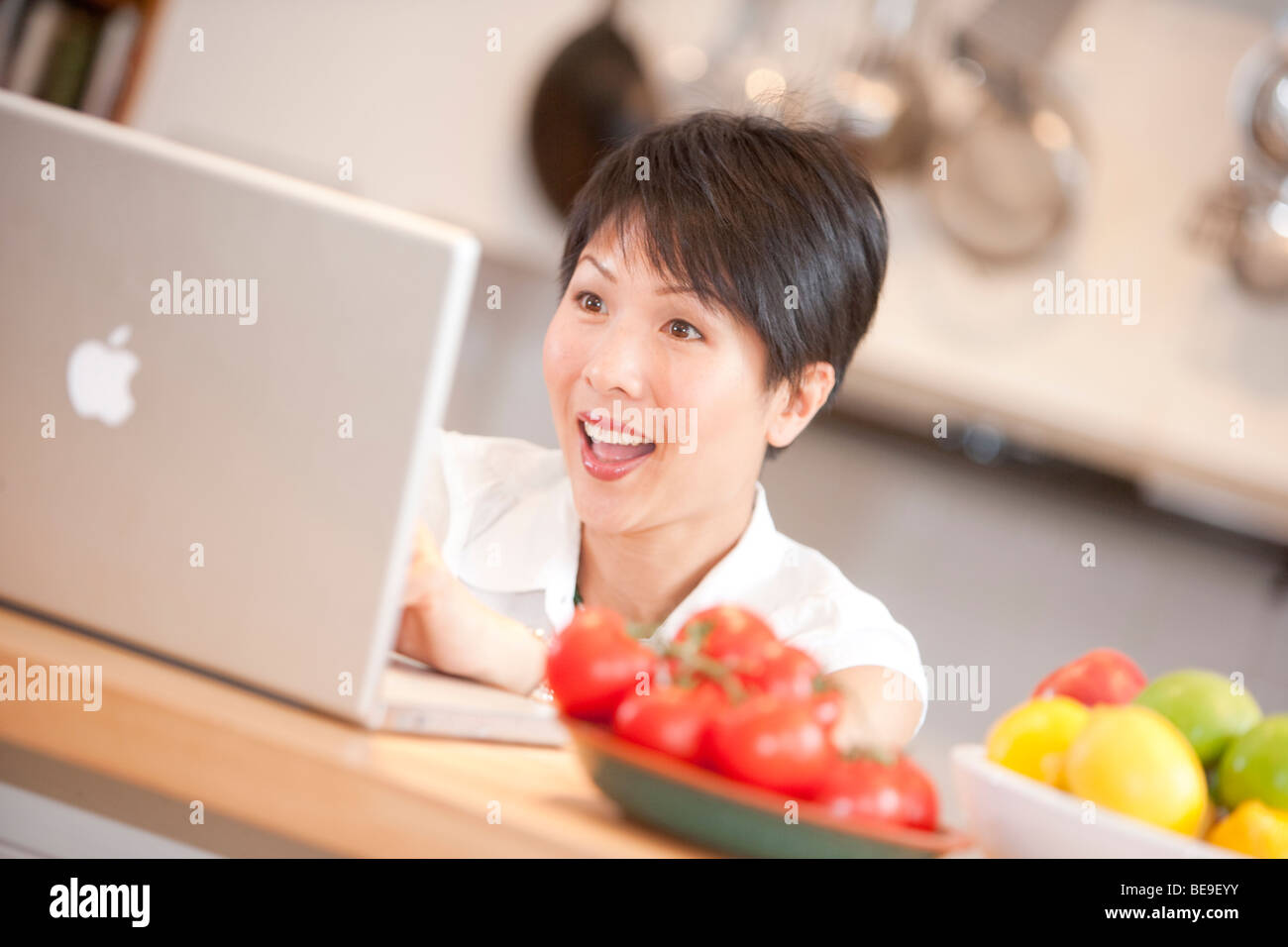 Oriental girl at computer Stock Photo - Alamy