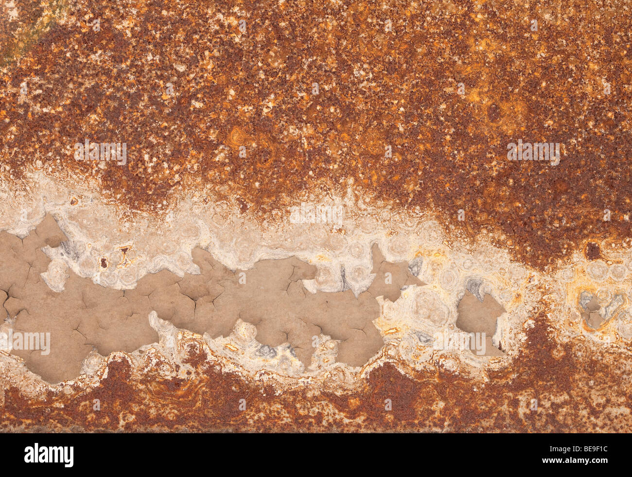 Rusty iron sheet with the peeled paint and corrosion stains background ...