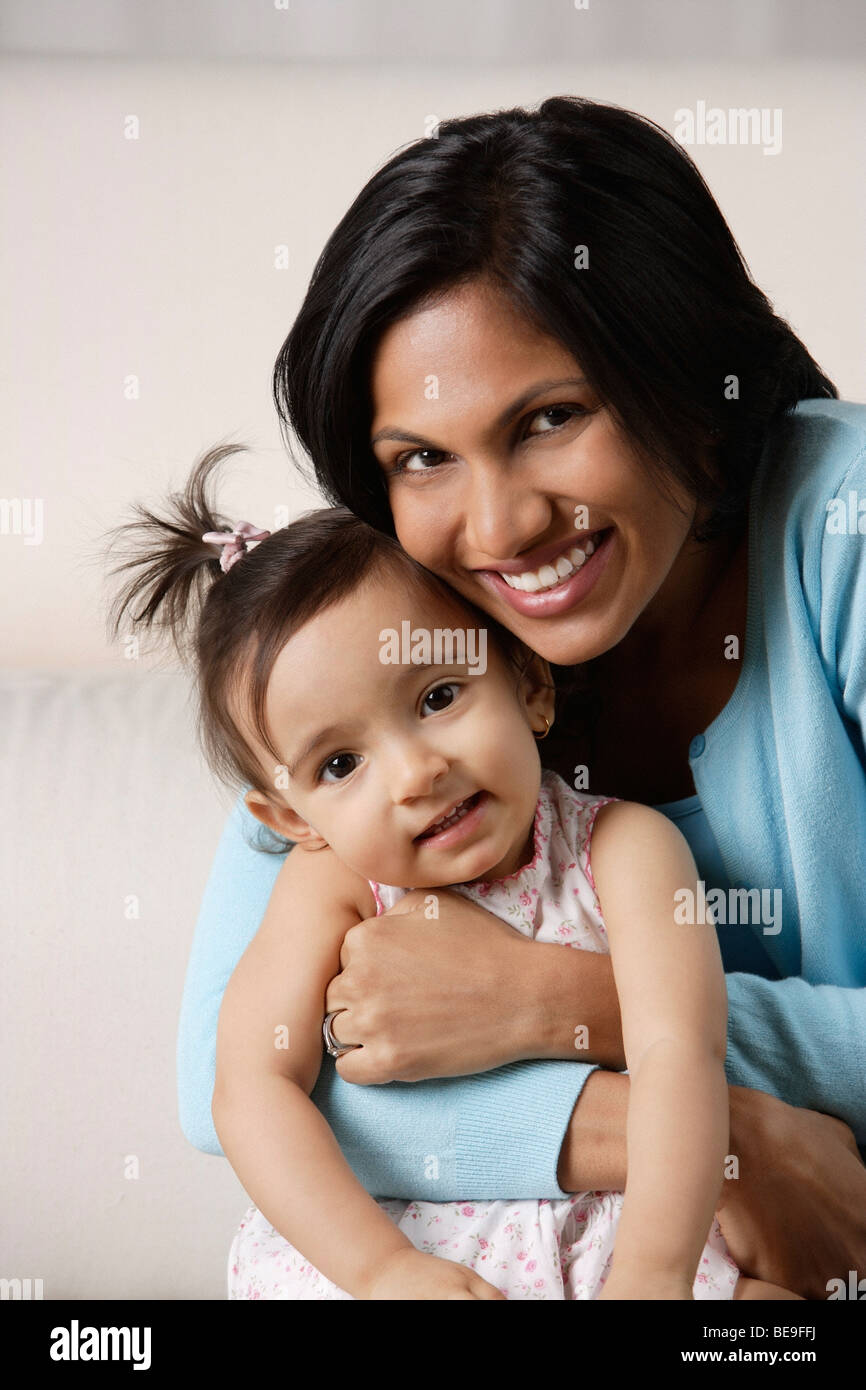 woman hugging her baby Stock Photo - Alamy