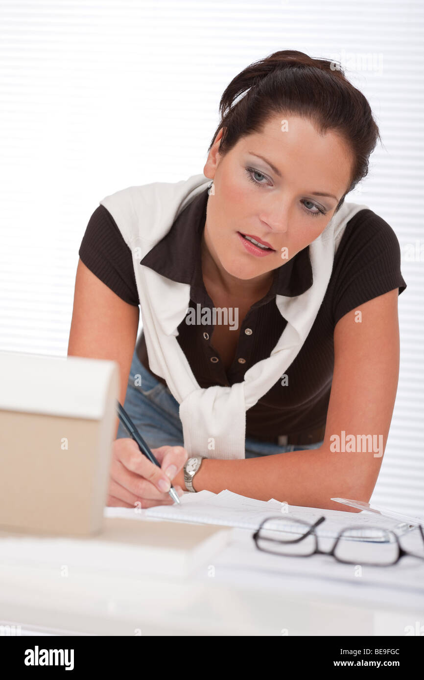Successful architect woman with architectural model at the office Stock ...
