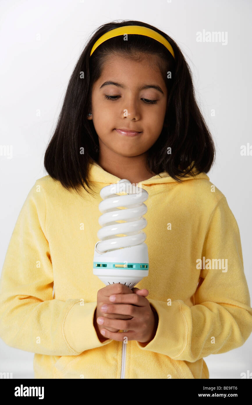 Girl holding light bulb Stock Photo - Alamy Girl holding light bulb Stock Photo - Alamy