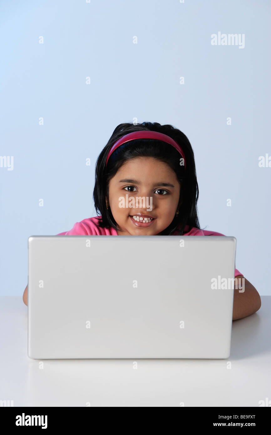 Little girl at laptop computer Stock Photo - Alamy