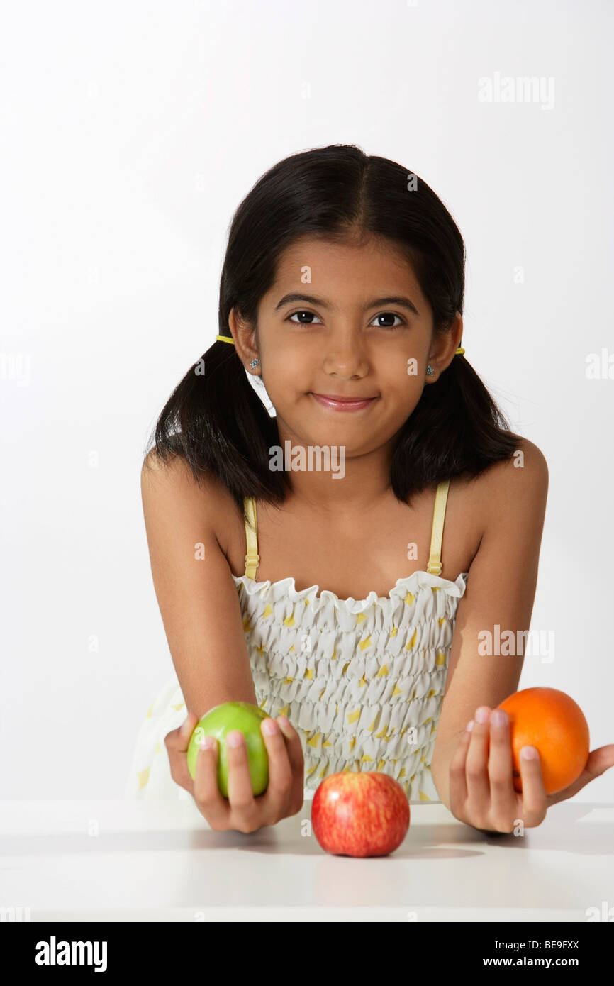 girl holding fruits Stock Photo - Alamy