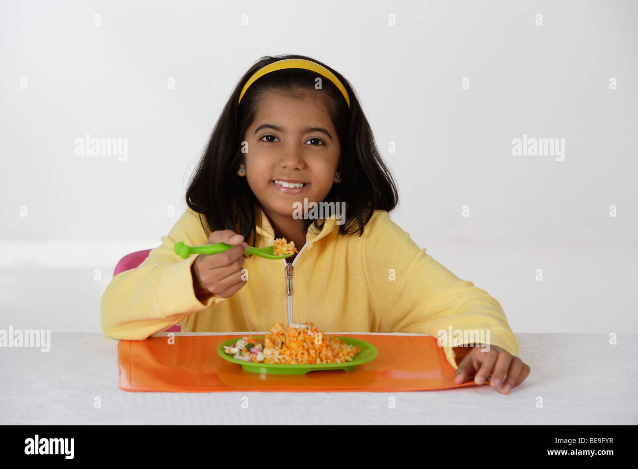 Girl eating briyani rice Stock Photo - Alamy