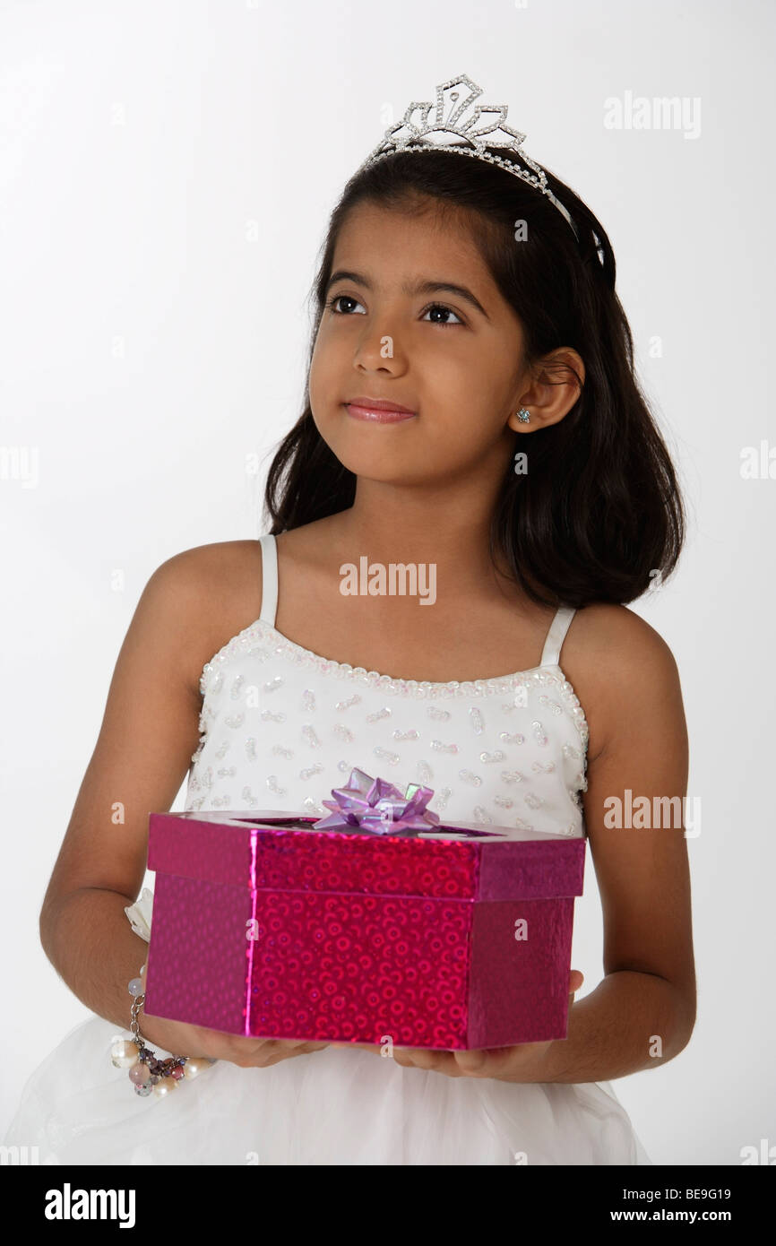 girl holding gift Stock Photo - Alamy