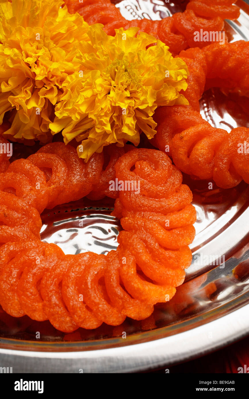 Close up of Indian sweets with flowers Stock Photo - Alamy