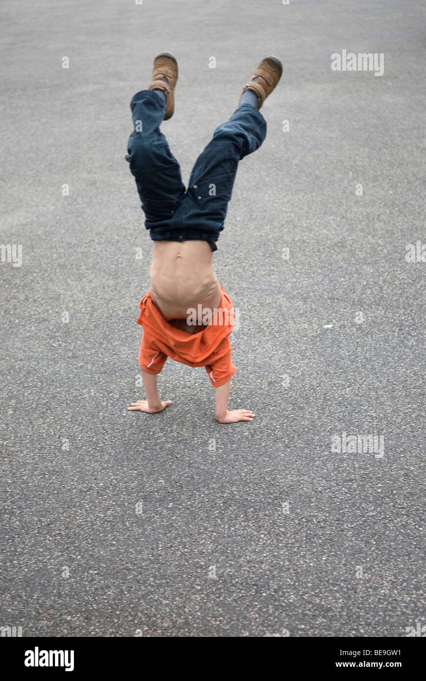 Boy,balancing with hands hi-res stock photography and images - Alamy