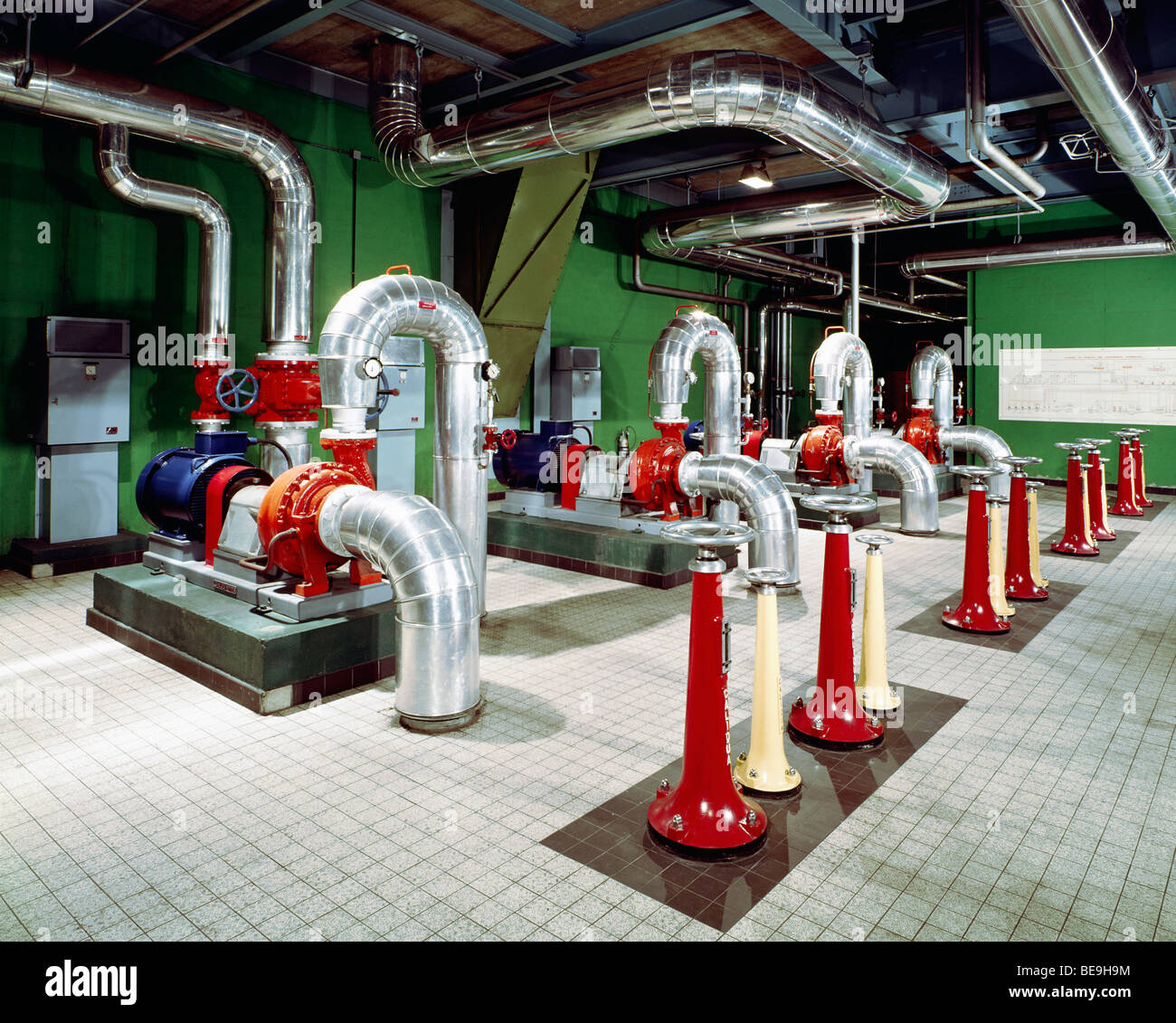 Pipe gates in industrial heating plant Stock Photo - Alamy