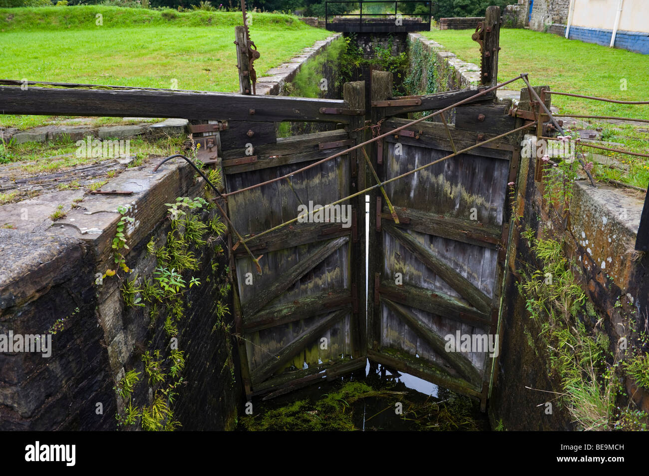 Old lock gates on disused and derelict section of the Neath Canal at ...