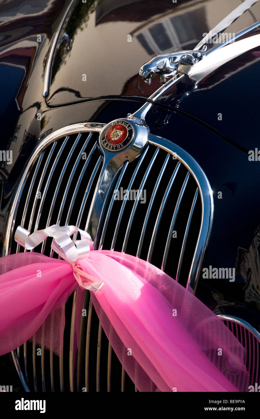 Wedding Car with pink ribbon Stock Photo - Alamy