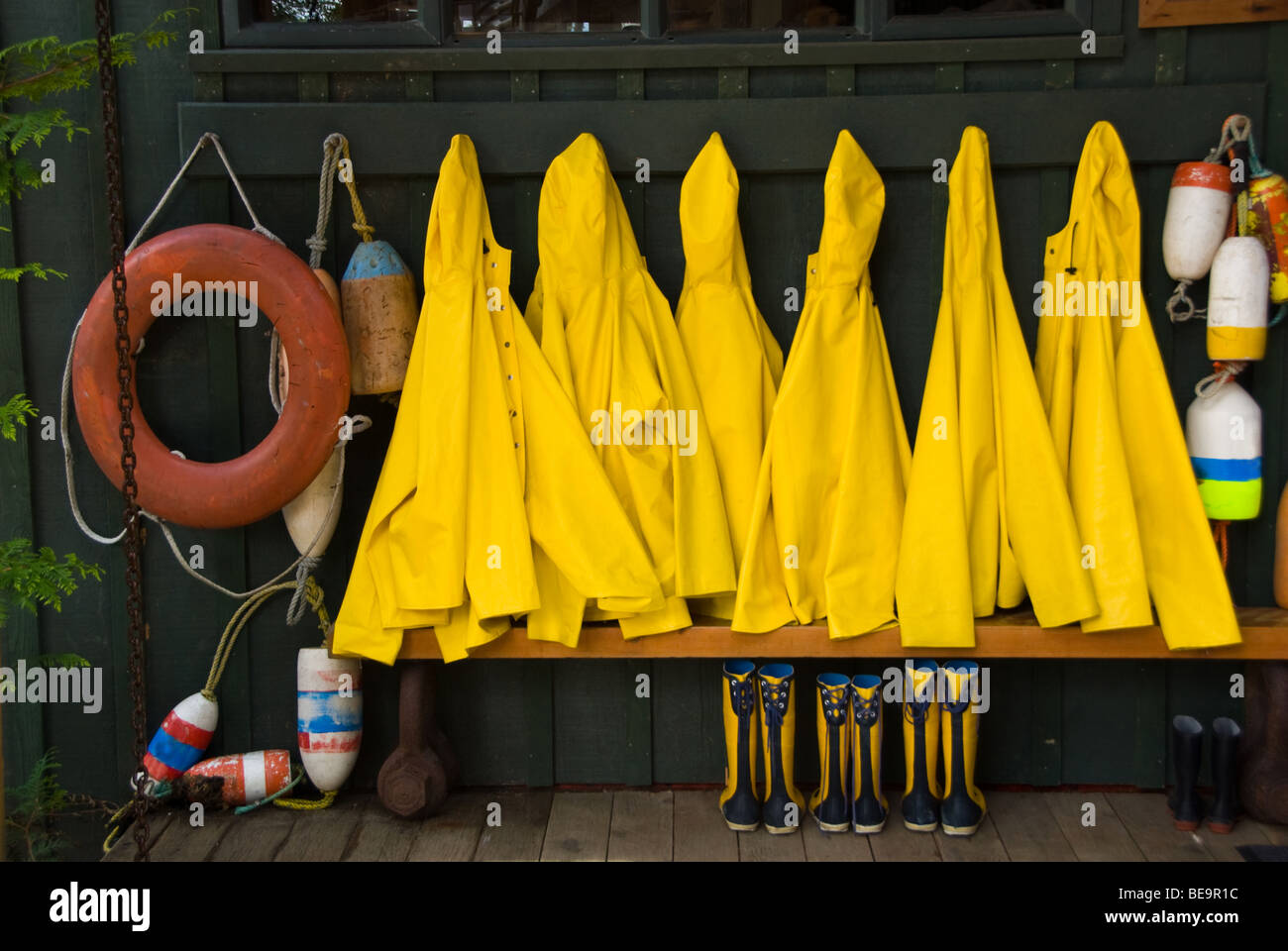 Raincoats boots hi-res stock photography and images - Alamy