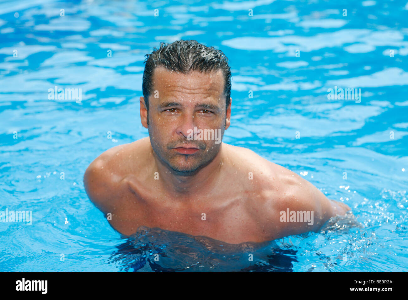 Portrait man in the swimming pool Stock Photo - Alamy