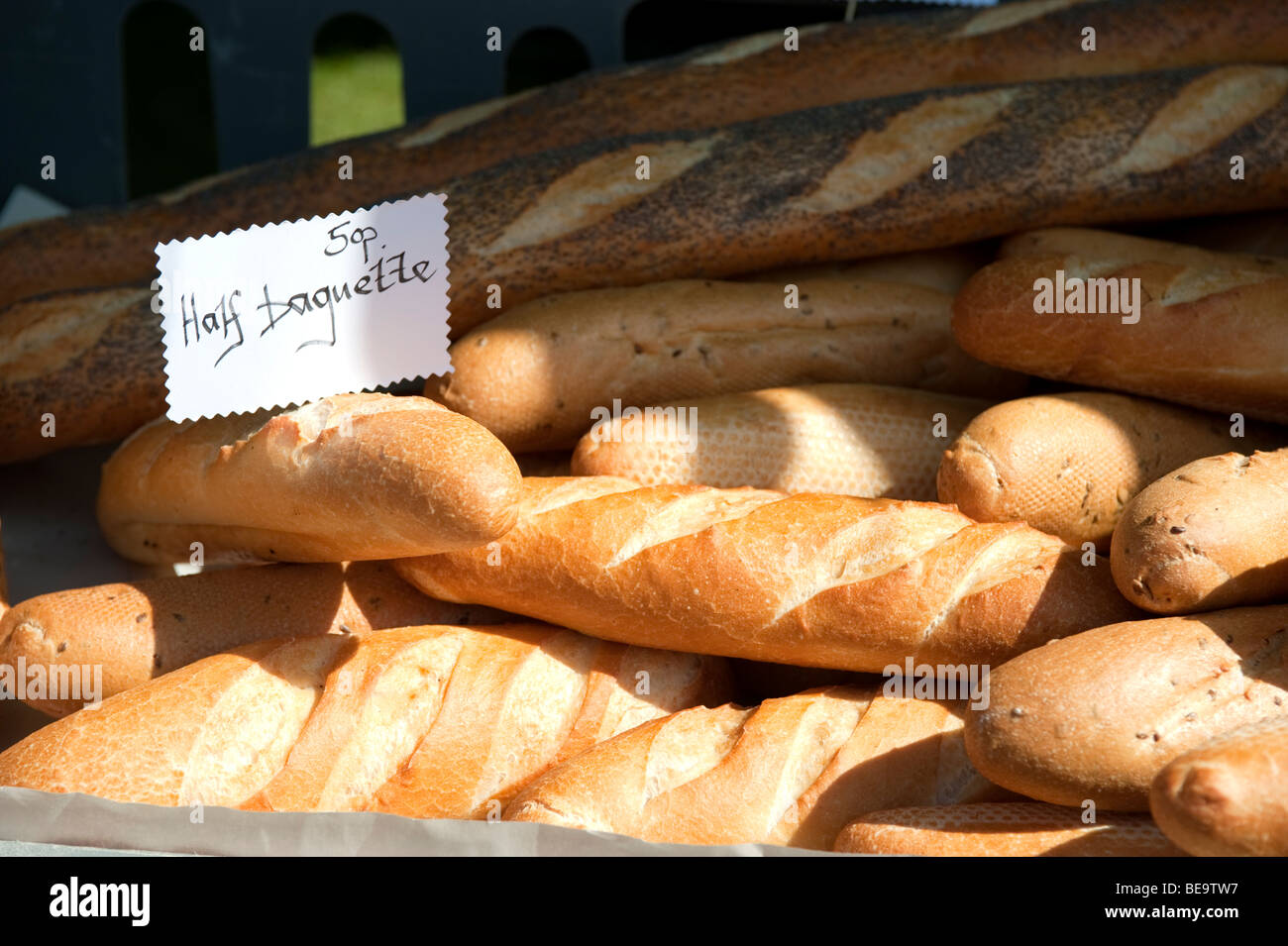 Fresh bread for sale on a market stall - close up Stock Photo - Alamy