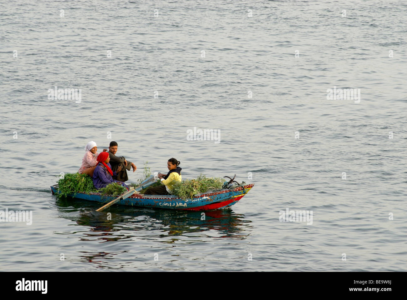 Egyptian woman rowing aboard a small boat the nile river hi-res stock ...