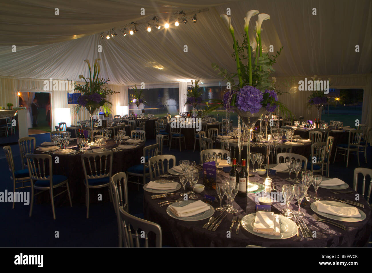 table place setting in a marquee Stock Photo - Alamy