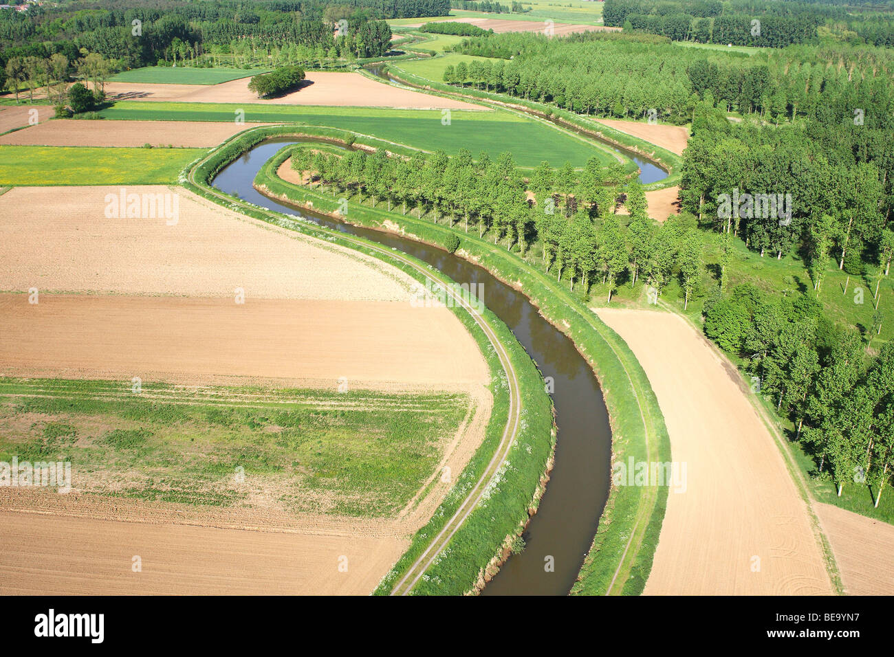Fields, grasslands and forested area along river Demer, valley of Demer ...