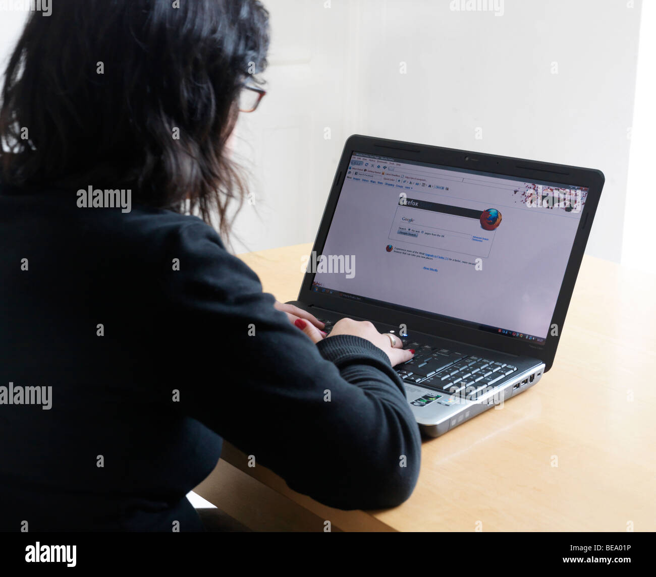 Young Person on a Hi-tech laptop on the Internet Stock Photo - Alamy