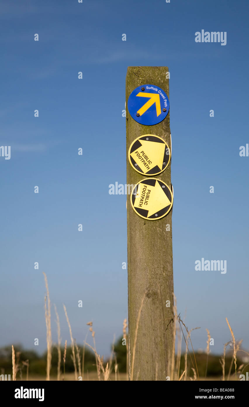 Footpath direction post with markers against blue sky, Hollesley ...