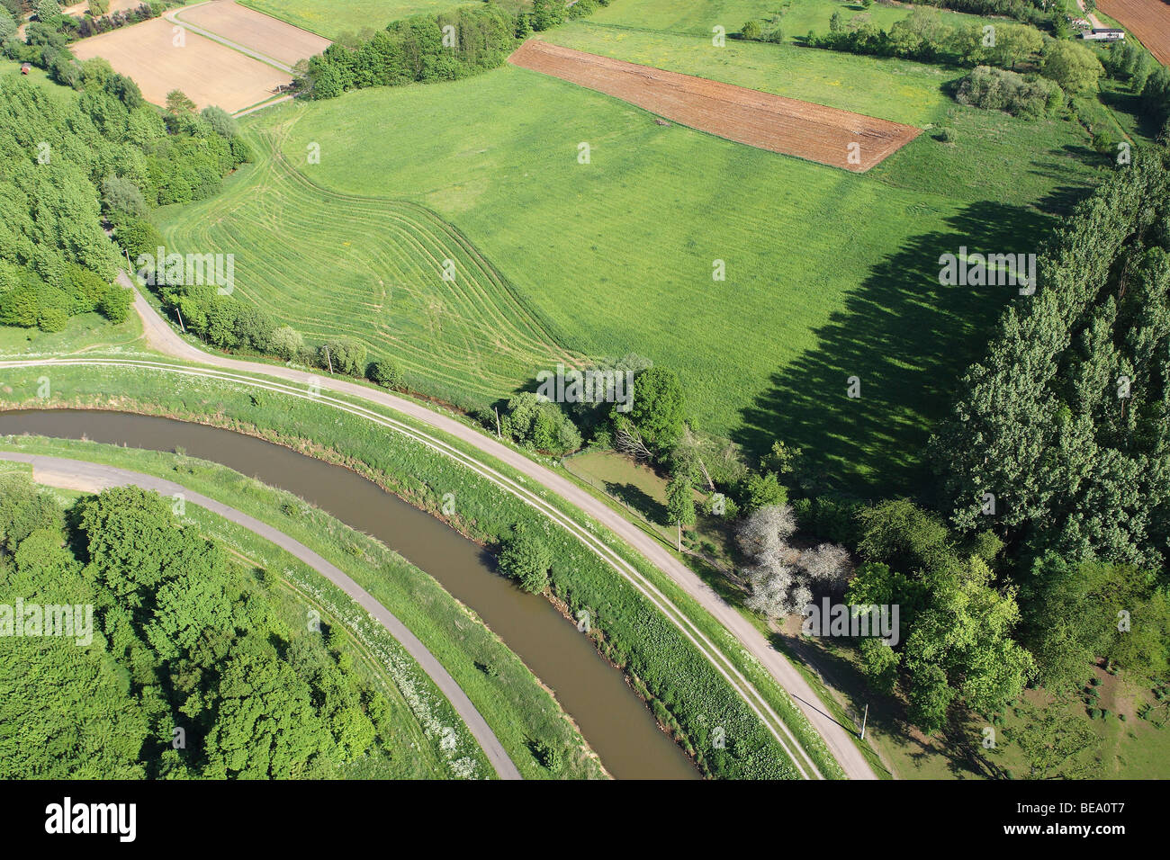 Fields, grasslands and forested area along river Demer, valley of Demer ...