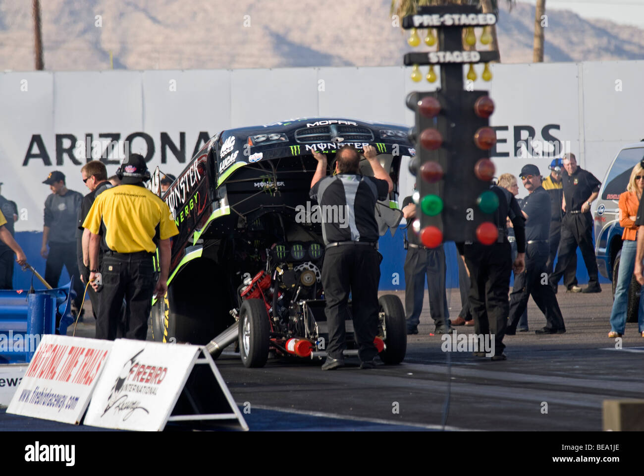 A crew looks at the funny car of Tommy Johnson at 2008 NHRA Time Trials ...