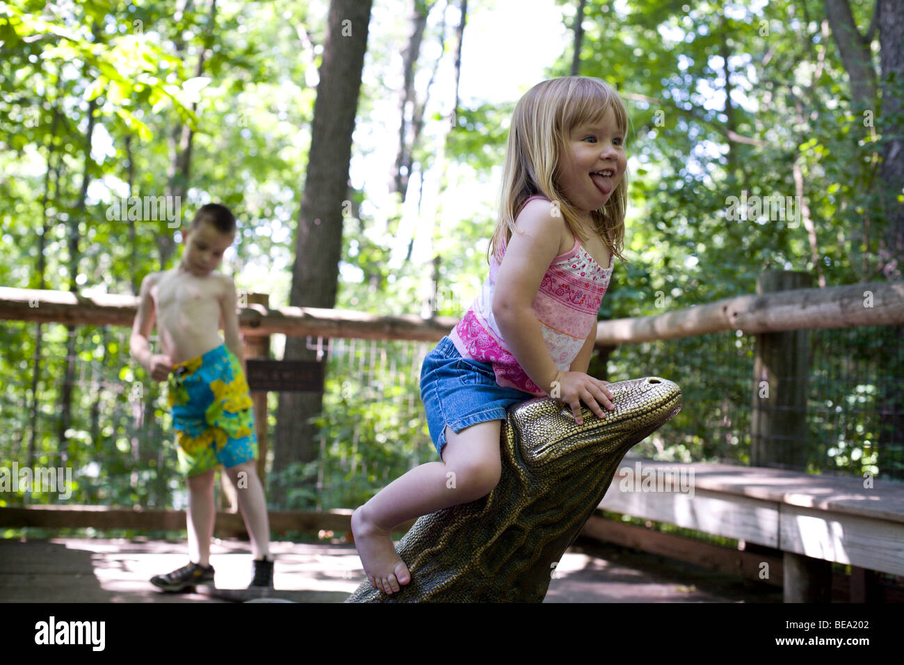 2 kids playing outside Stock Photo - Alamy