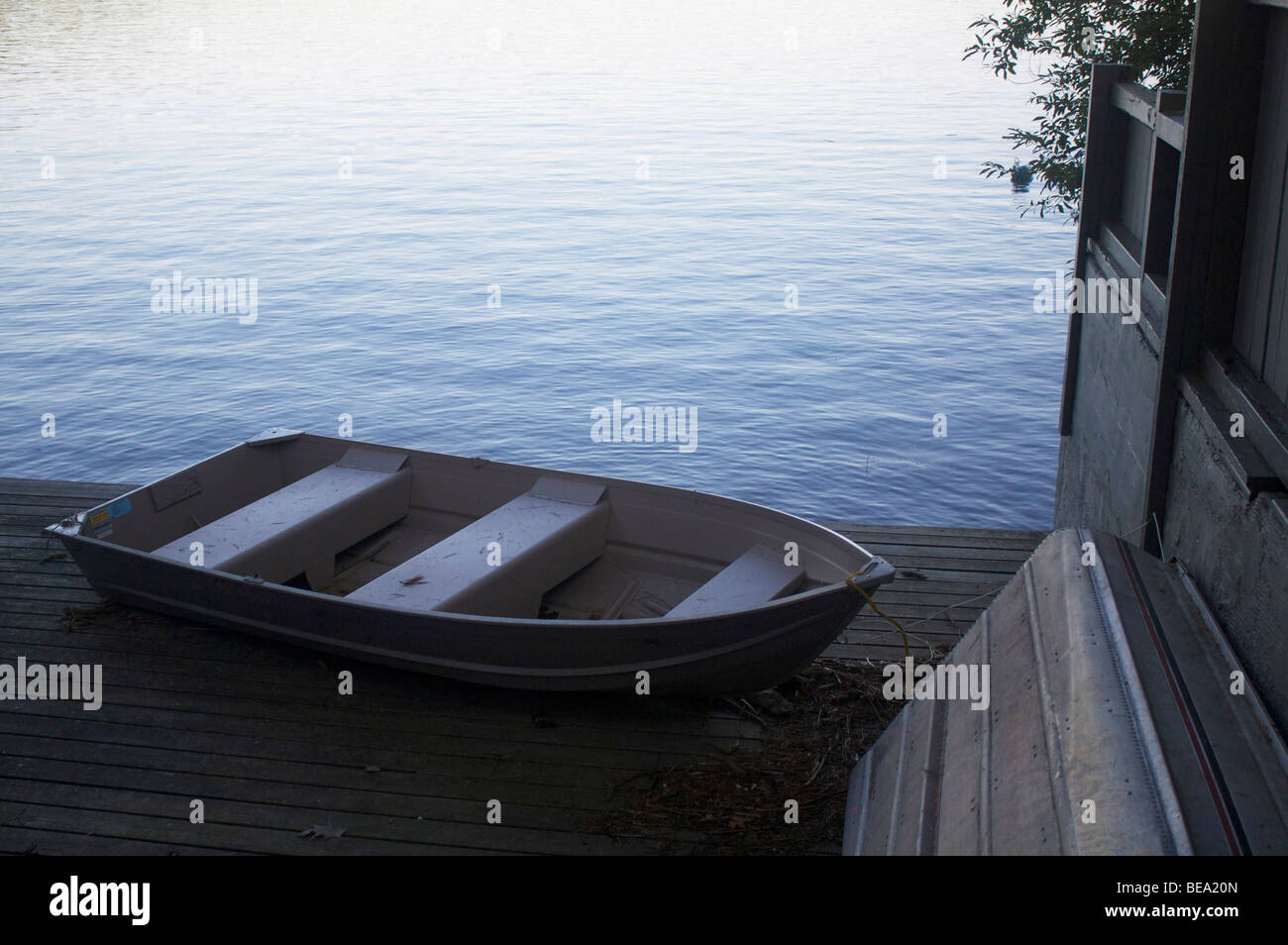Row boats docked by a lake Stock Photo - Alamy