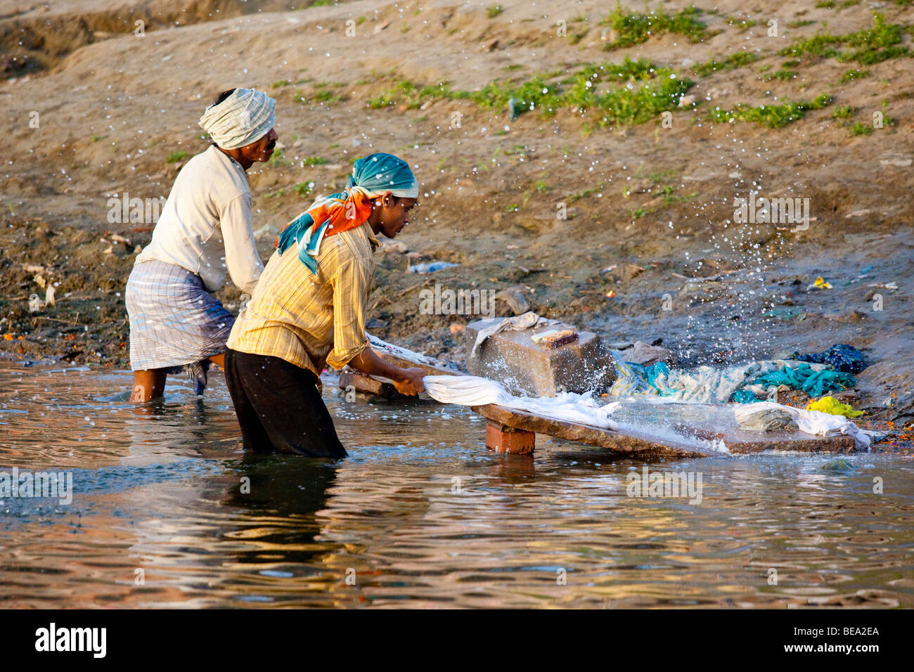 Dhobi Washing Clothes in the Ganges River in Varanasi India Stock Photo ...