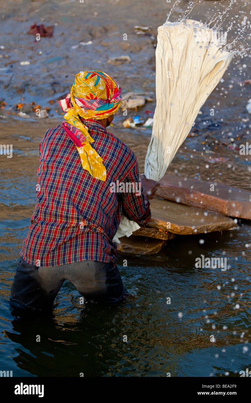 Indian man washing clothes in hi-res stock photography and images - Alamy