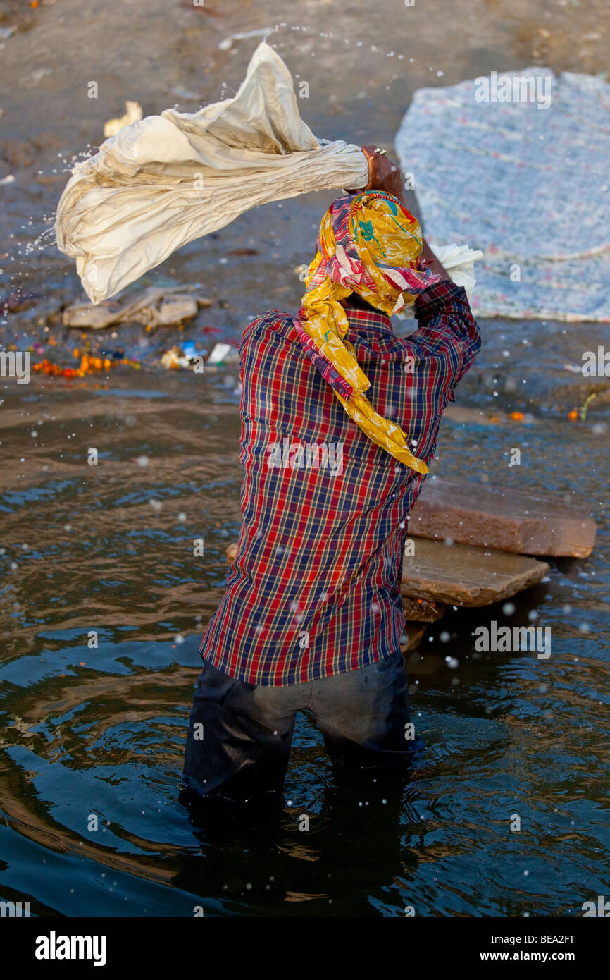 Indian man washing clothes in hi-res stock photography and images - Alamy