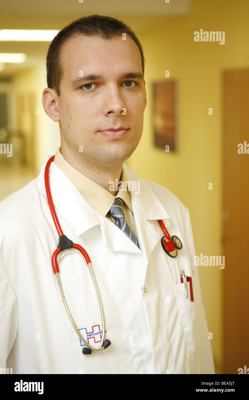 Portrait of physician in hospital corridor Stock Photo - Alamy