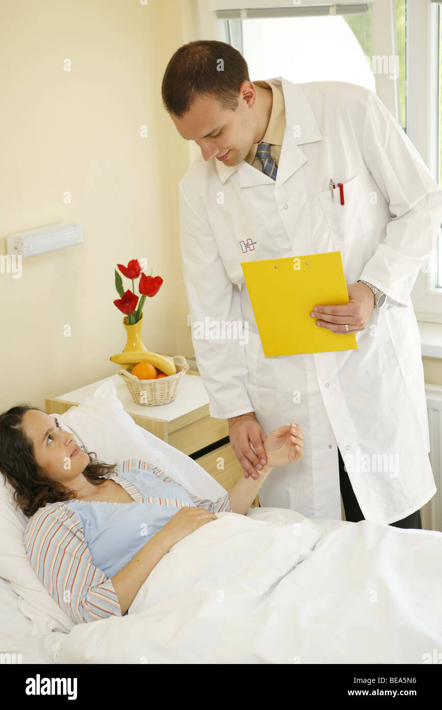 Doctor Talking To Patient In The Patient S Room Stock Photo Alamy